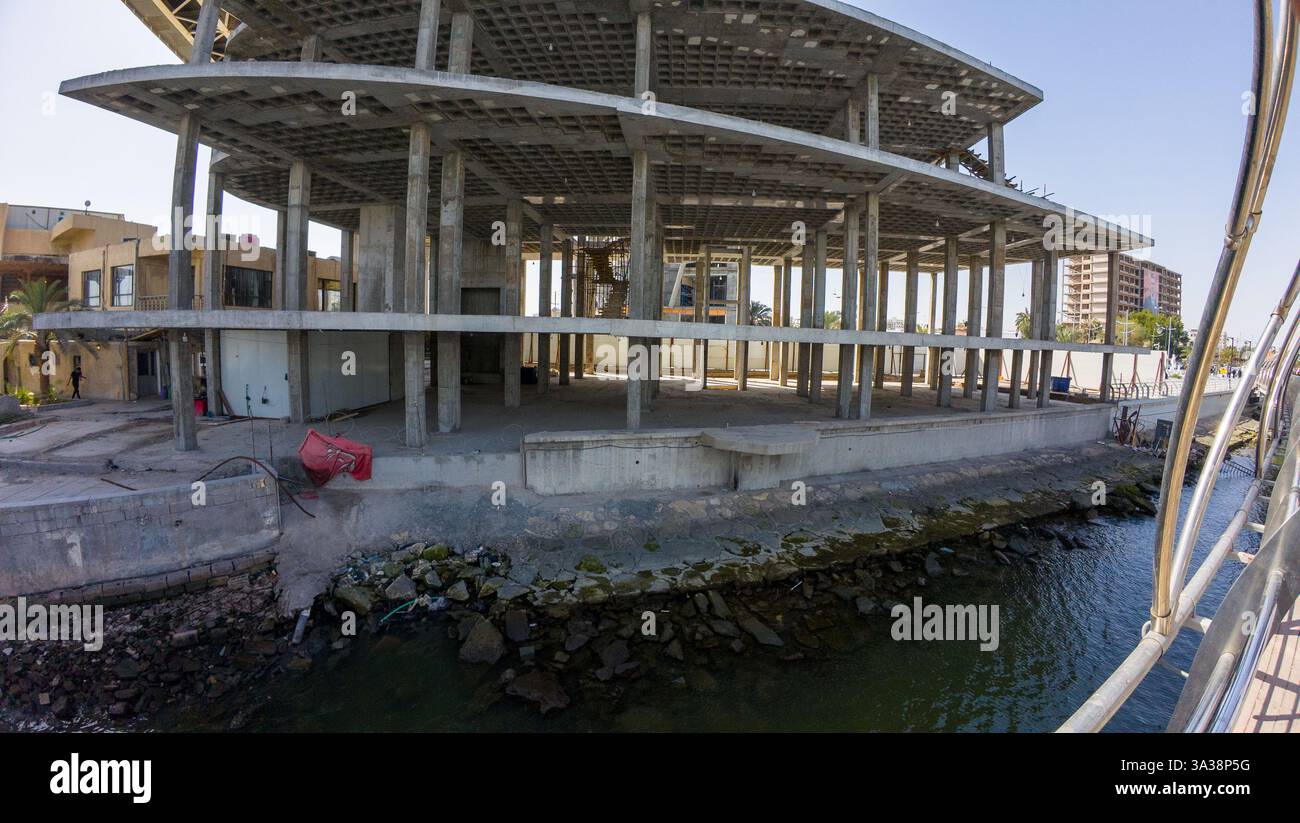 A partially constructed building with exposed concrete beams and ...