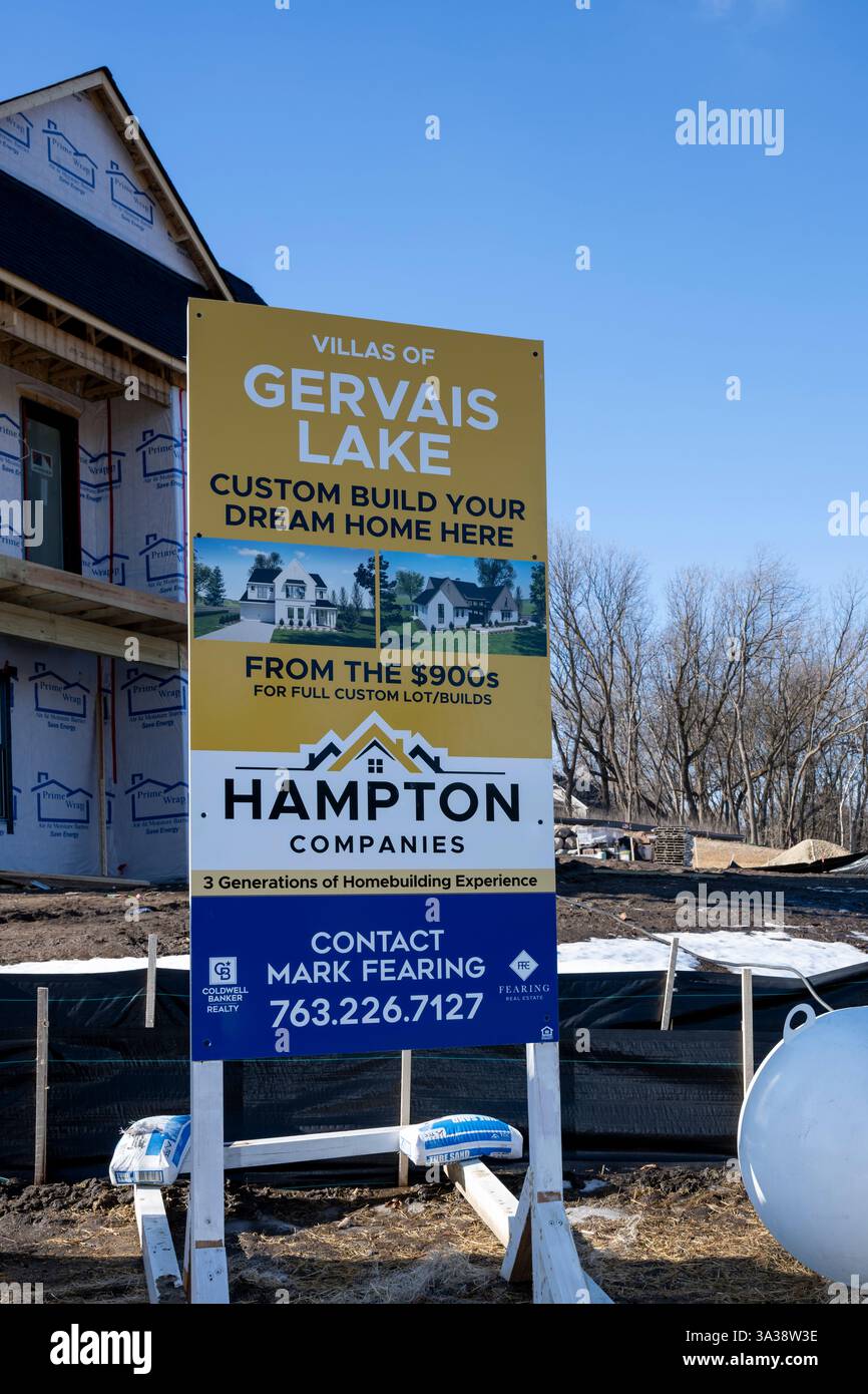 Little Canada, Minnesota. A sign advertising custom built homes for ...