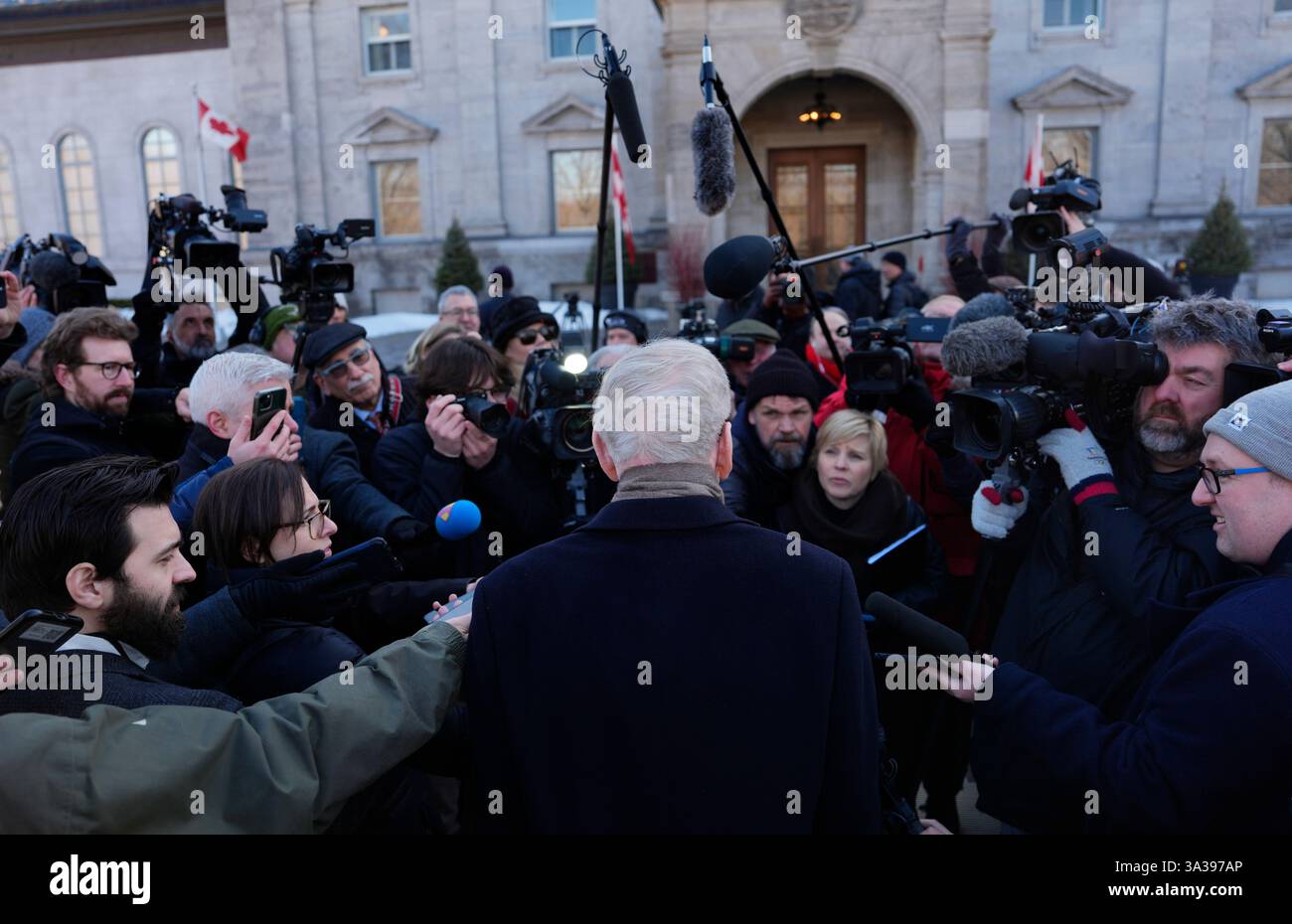Former Liberal prime minister Jean Chretien talks to media as he ...
