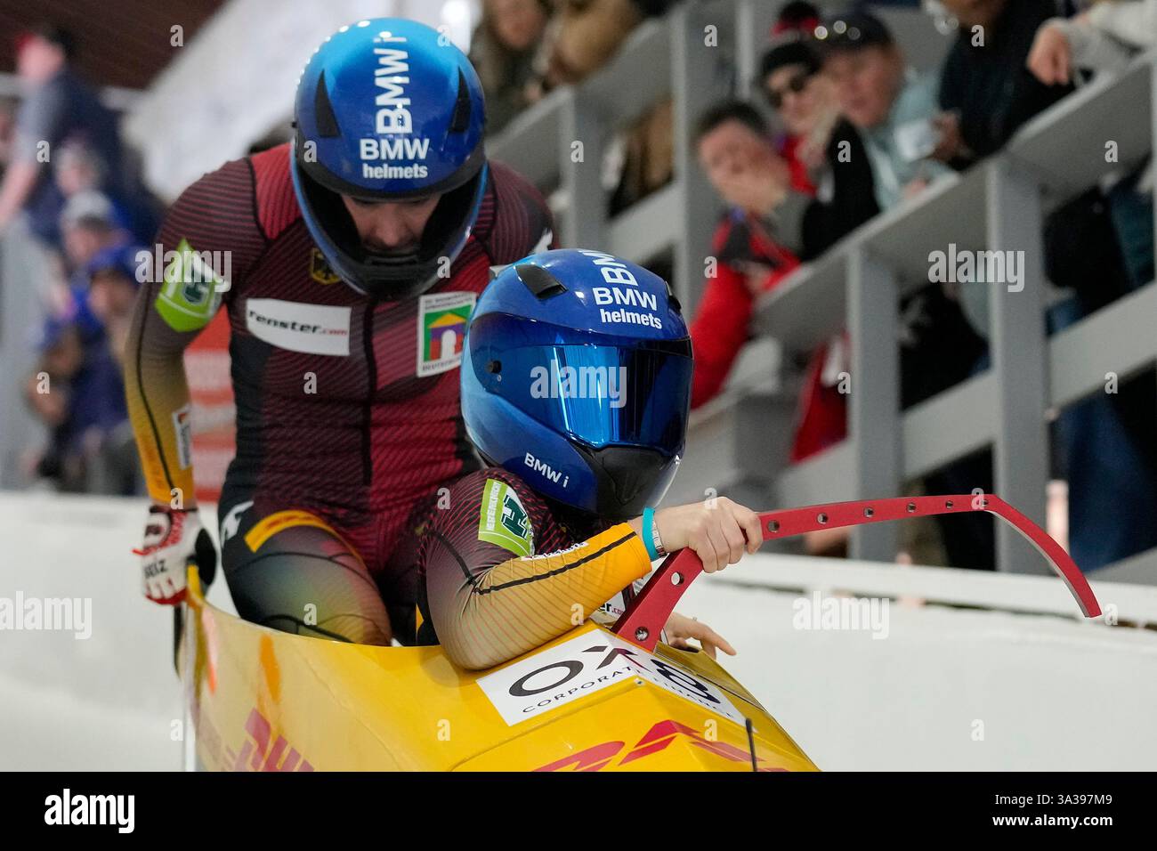 Germany's Kim Kalicki and Leonie Fiebig load the sled on their first ...