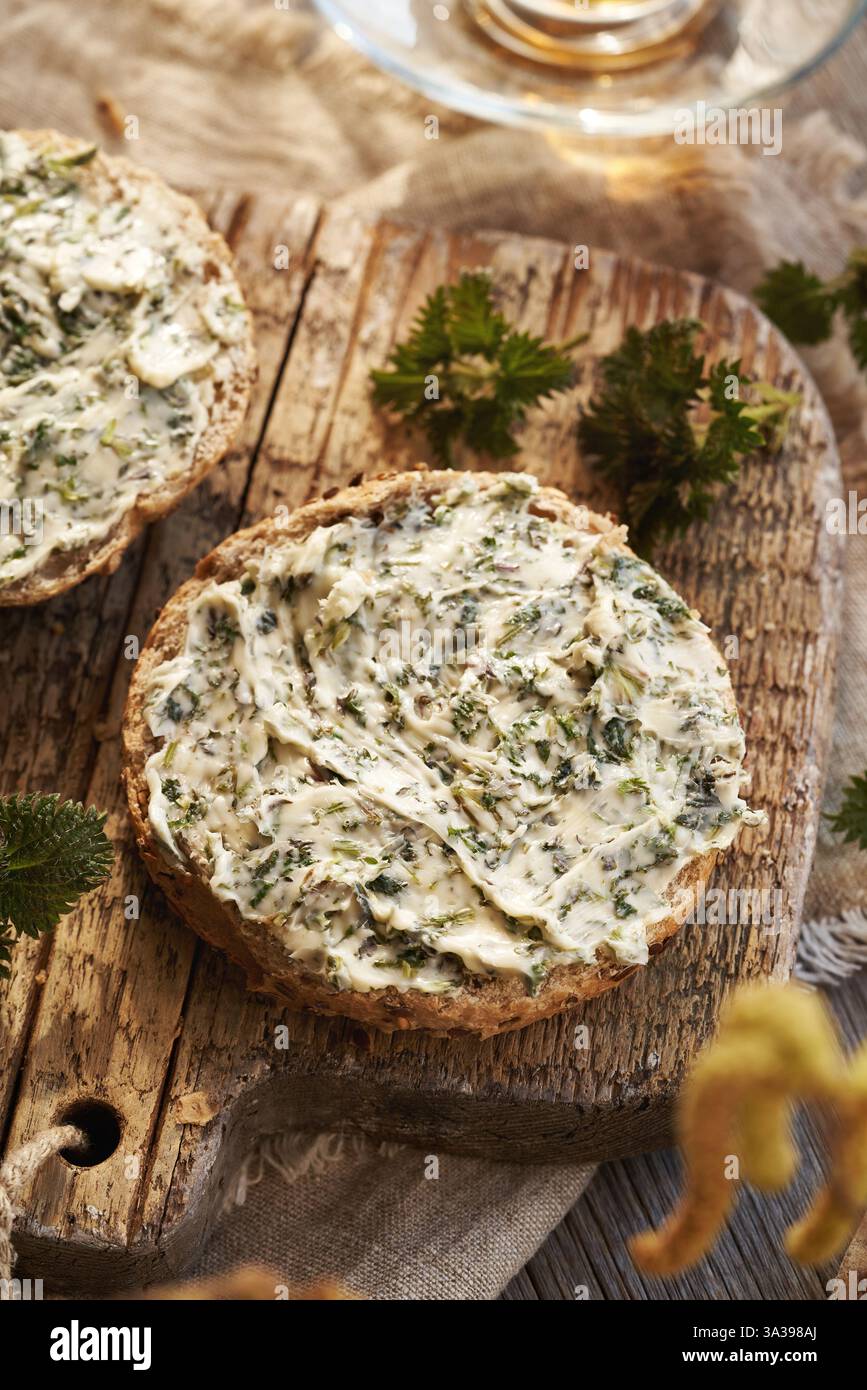 Nettle butter - homemade spread made of wild edible plants, on a slice ...