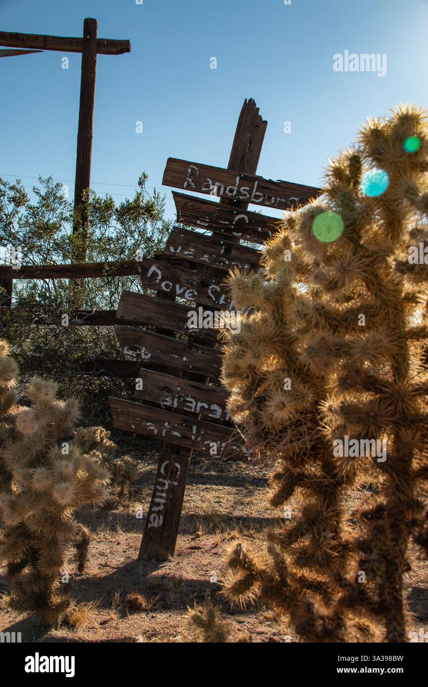 An old wooden sign post with directions to a variety of far away ...