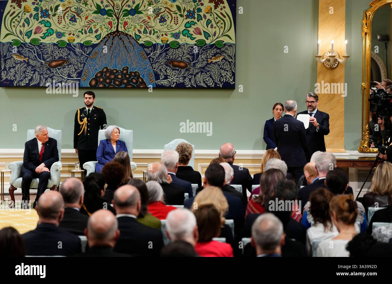 Ottawa, Canada. 14th Mar, 2025. Mark Carney (right) is sworn in as the ...