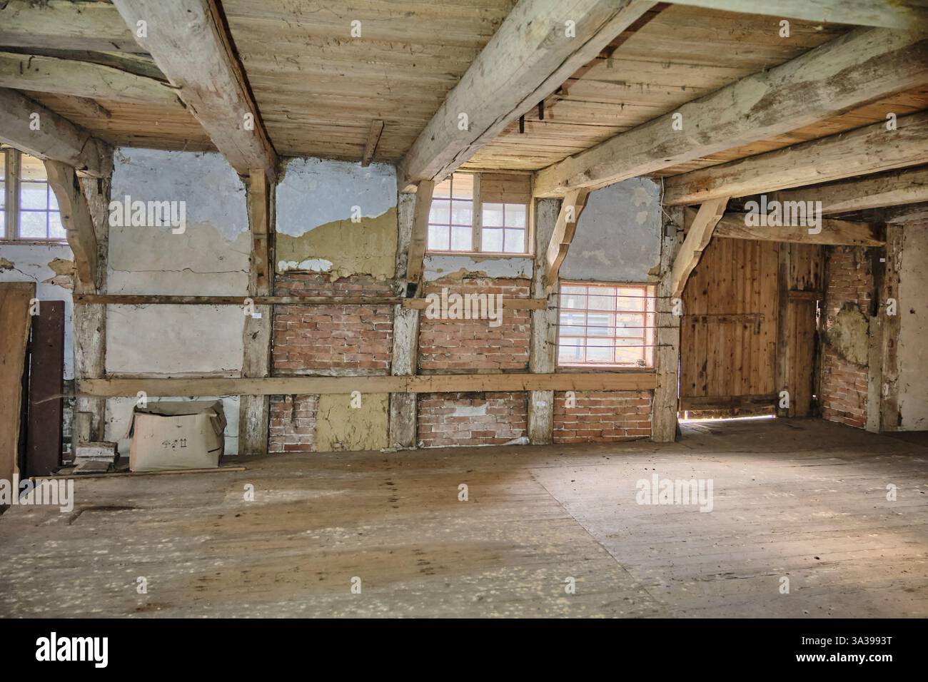 March 12, 2025 - Hoya-Germany: Aged wooden beams, brick walls, and worn ...