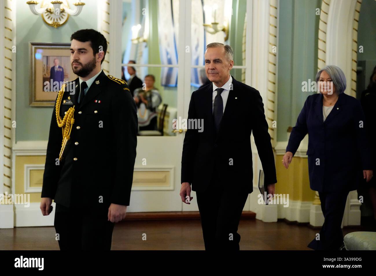 Prime minister-designate Mark Carney, centre, and Gov. Gen. Mary Simon, right, arrive for a ...