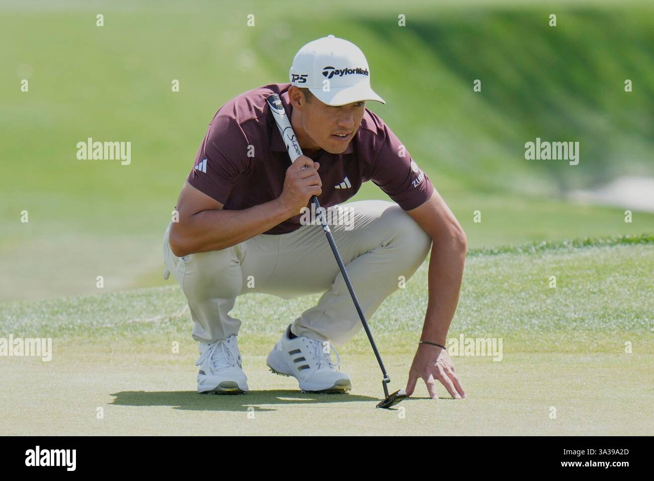 Collin Morikawa lines up a birdie putt on the ninth hole during the ...