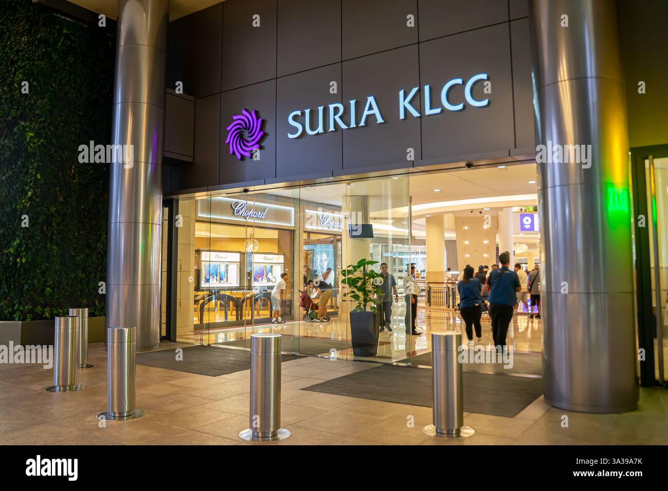 the entrance of Suria KLCC, a shopping mall located at the base of the ...