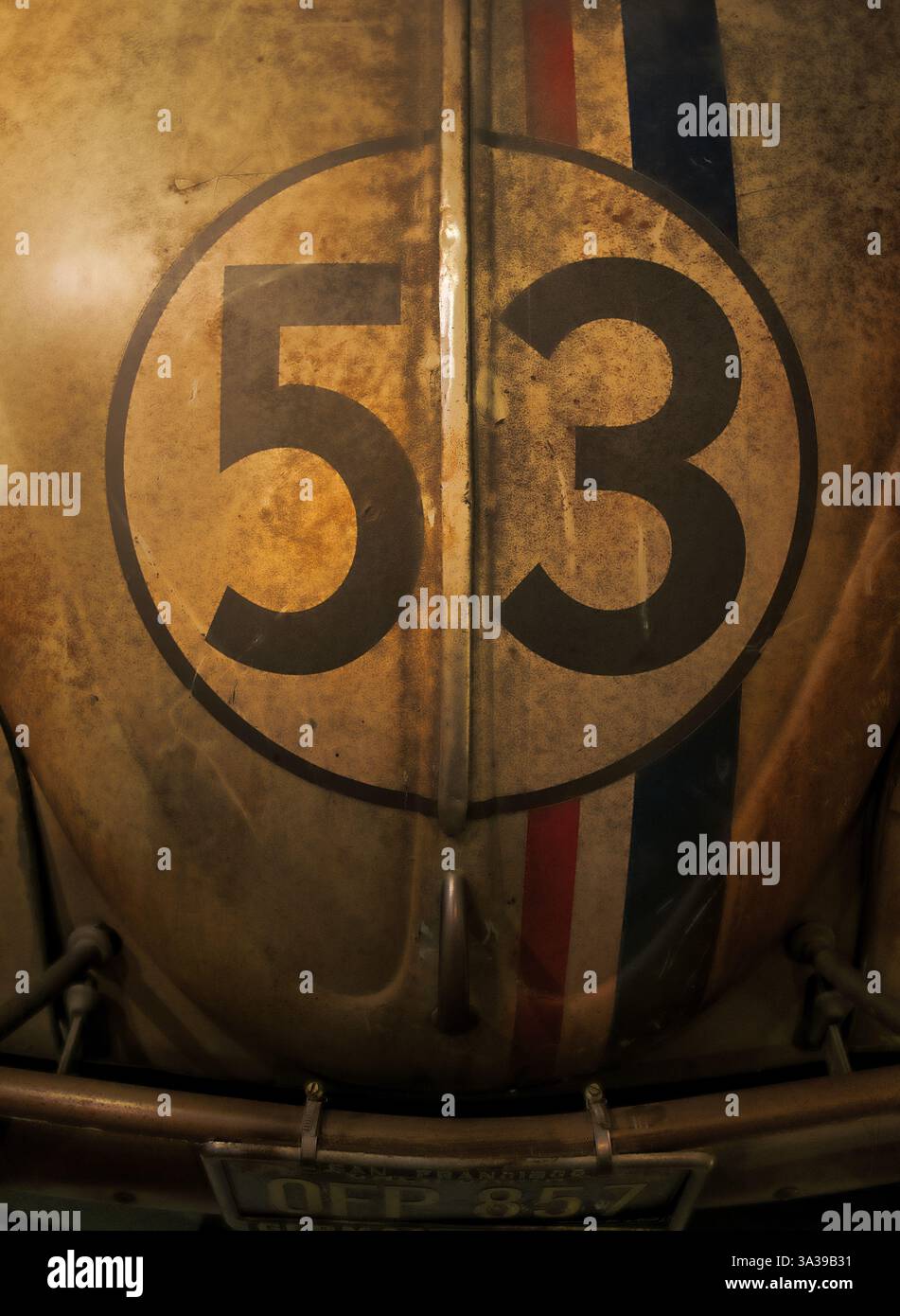 Close-up of a weathered vintage car covered in dirt and patina ...