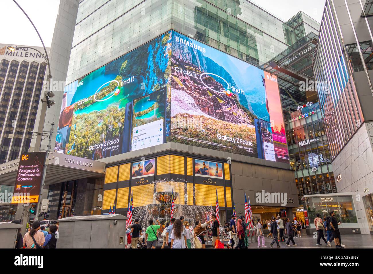 large LED screen wraps around the corner of the building and features a ...