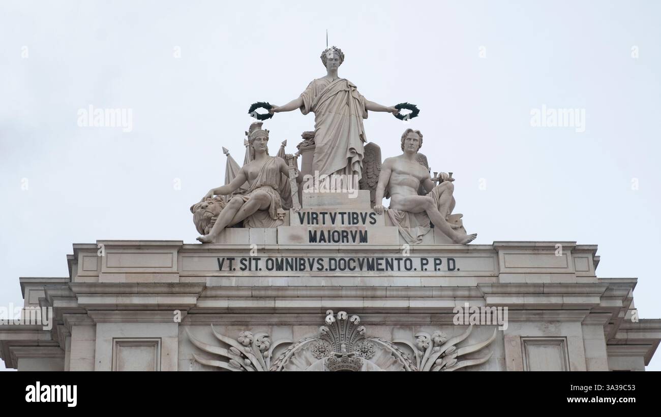 Glory statue standing atop ornate rua augusta arch, bearing laurel ...