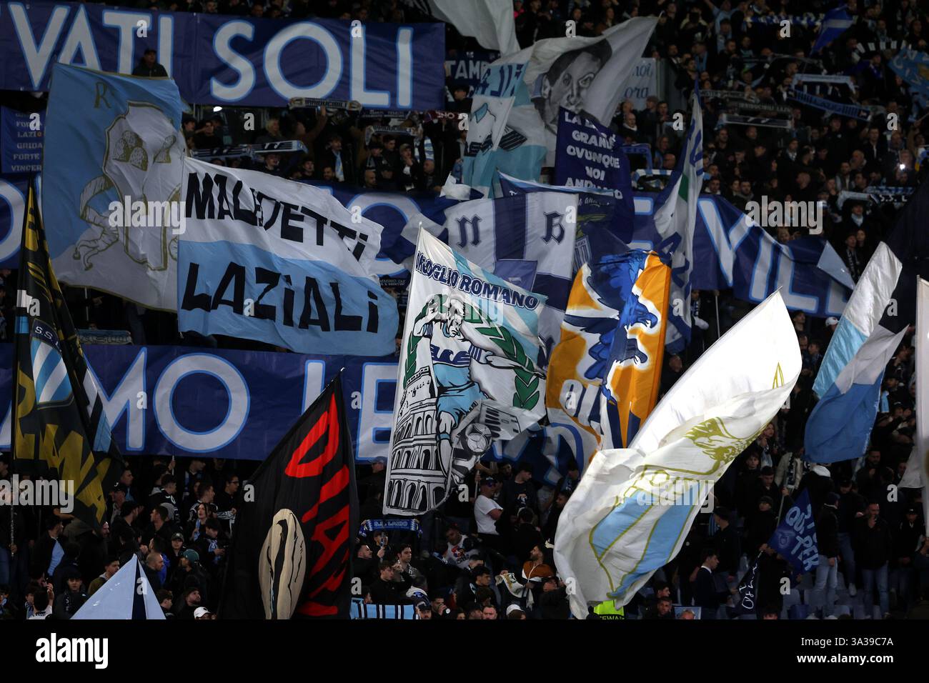 Rome, Italy. 13th Mar, 2025. Lazio fans wave flags during the UEFA ...