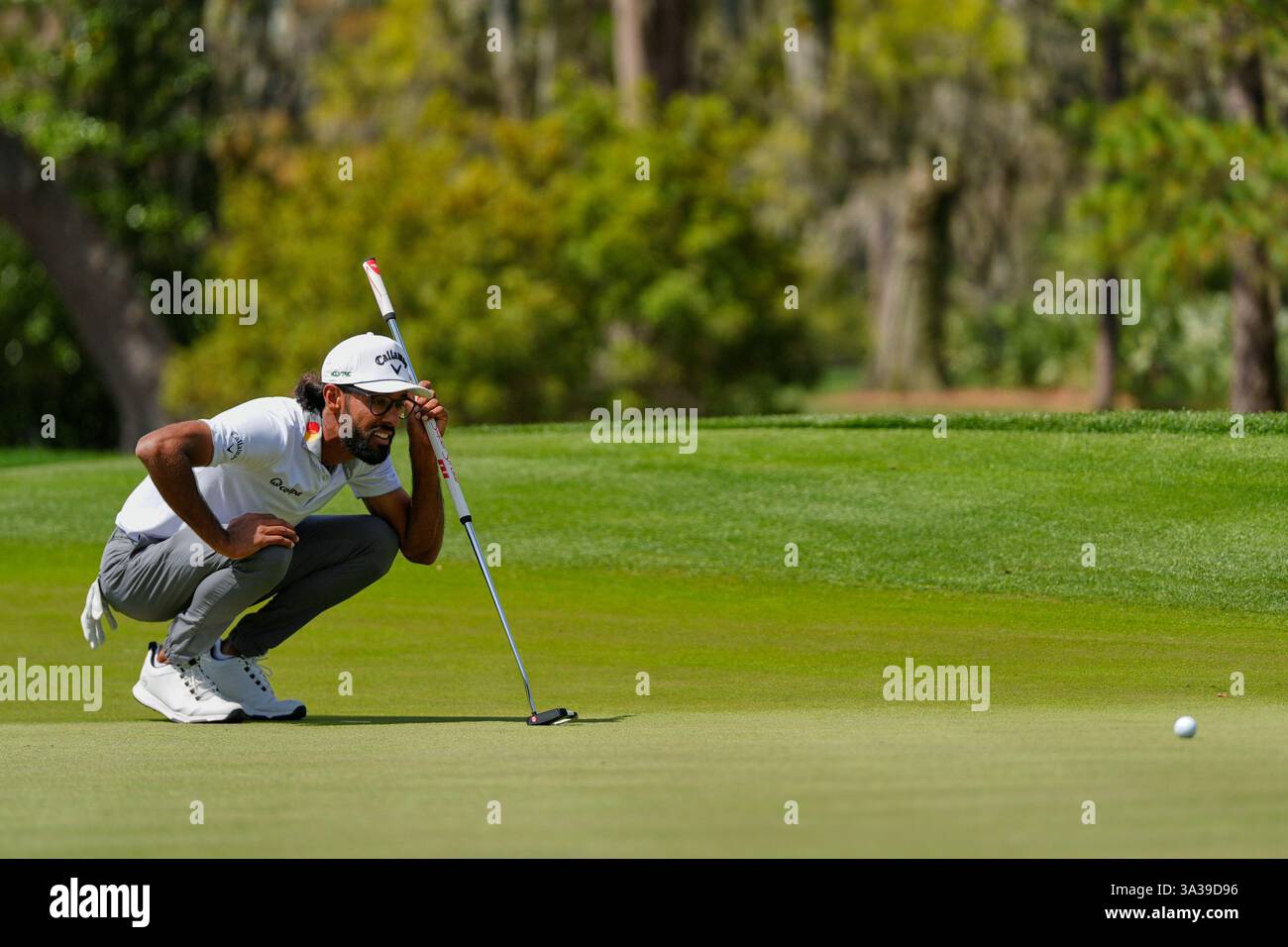 Akshay Bhatia lines up a putt on the seventh green during the second ...