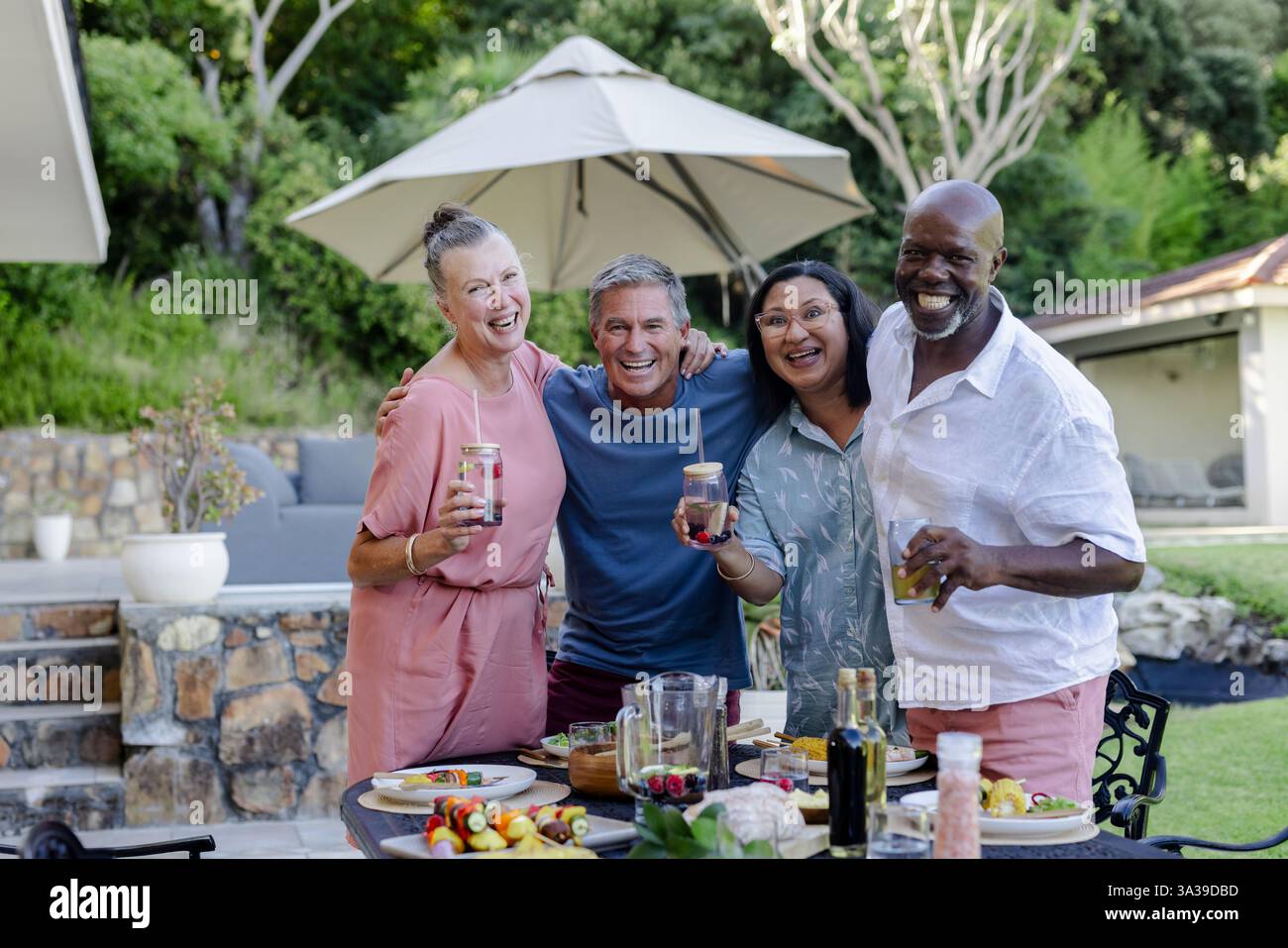 Gathering in backyard diverse seniors hi-res stock photography and ...