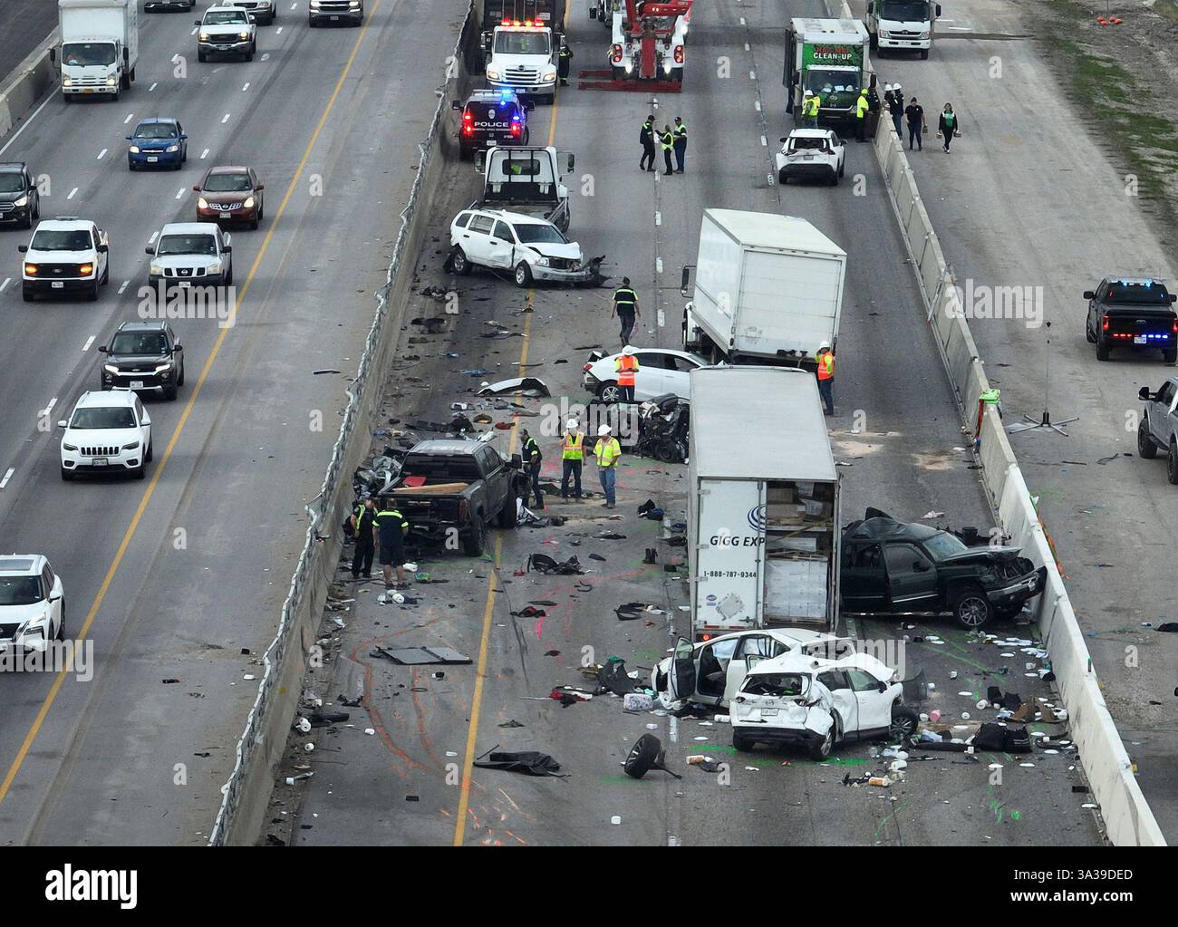 Officials examine the aftermath of a fatal crash on I-35 southbound ...