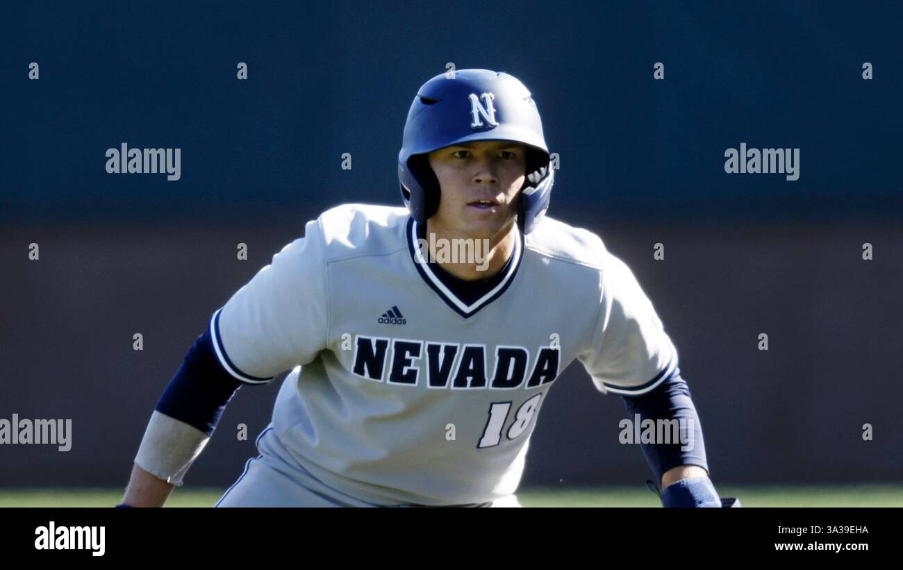 Nevada base runner Jake Harvey (18) looks on from first base during an ...