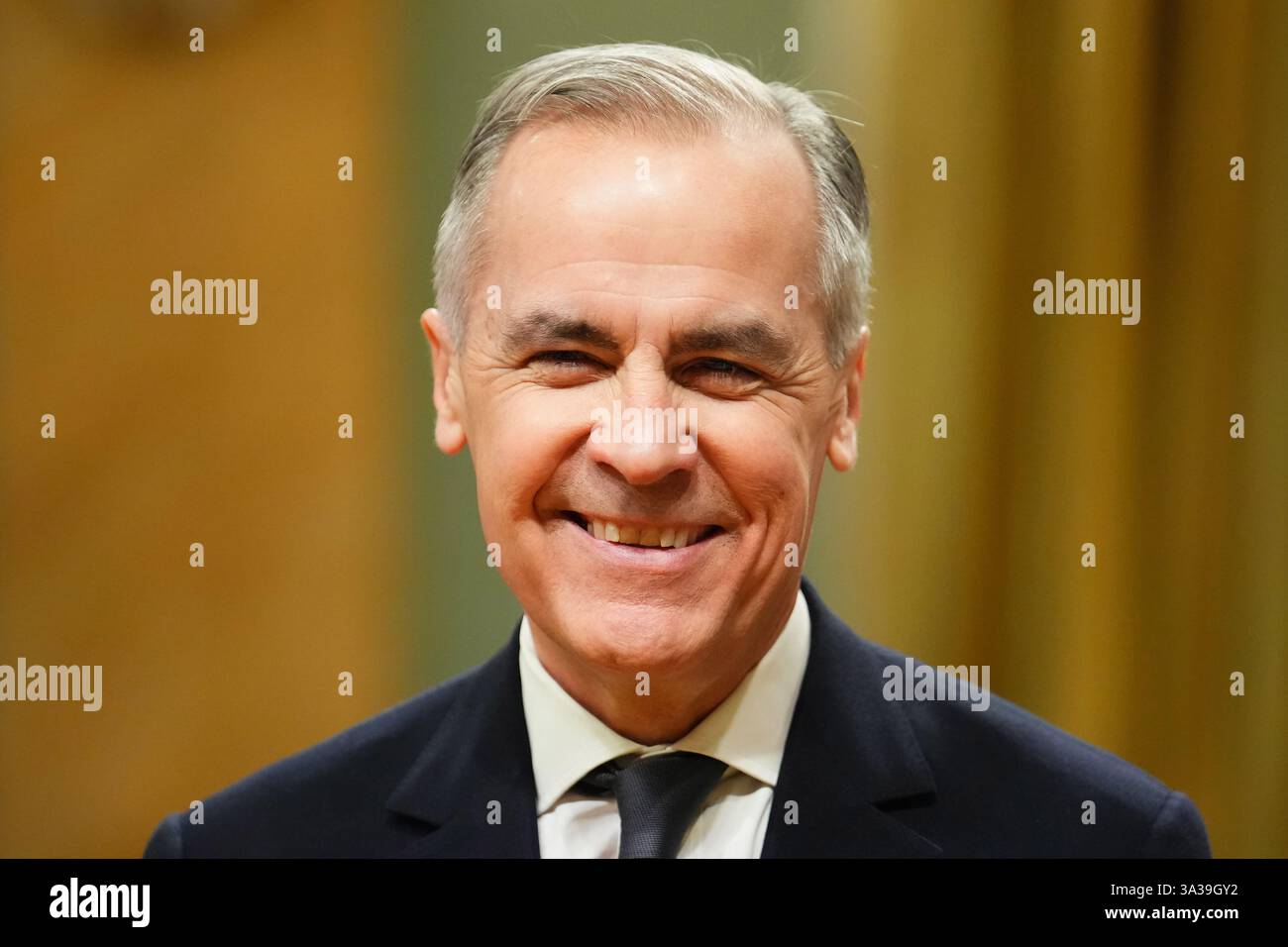 Prime Minister Mark Carney looks on during a swearing in ceremony at ...