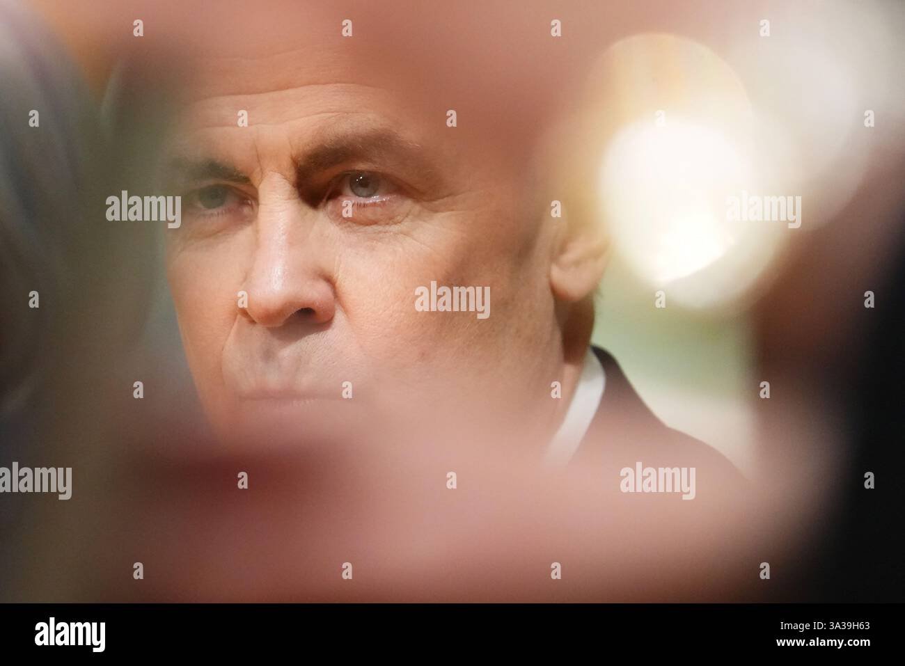 Prime Minister Mark Carney looks on during a swearing in ceremony at ...