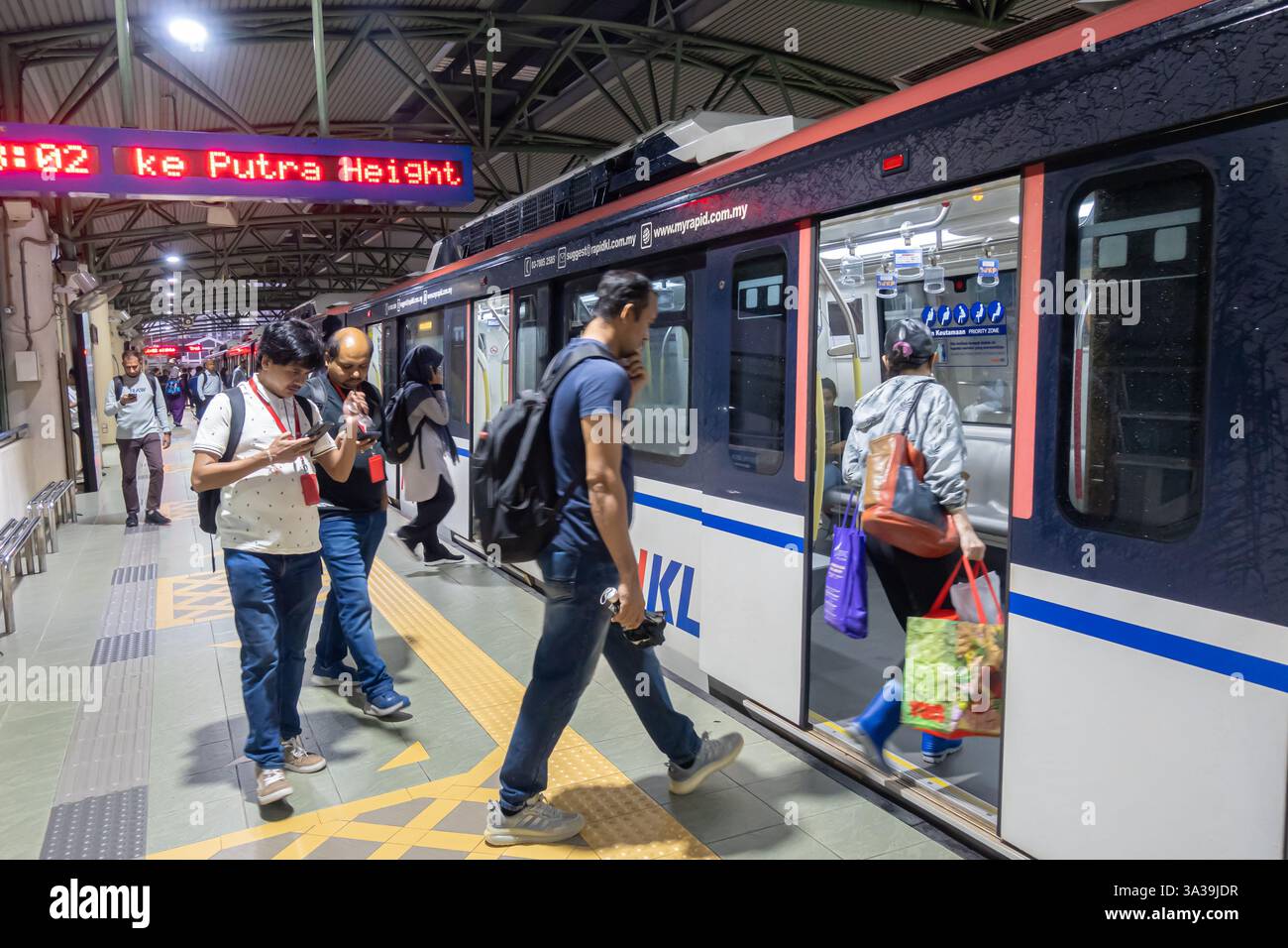 passengers entering a train station, Kuala Lumpur Malaysia RT (Light ...
