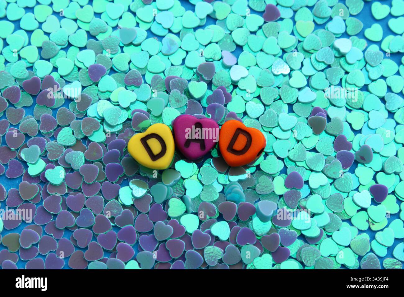 Background filled with colorful hearts with the word DAD Stock Photo ...