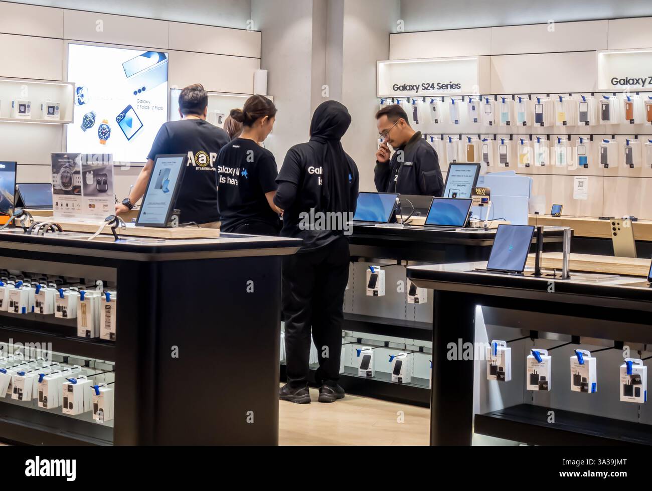 interior of a Samsung store, offering Galaxy smartphones, employees ...