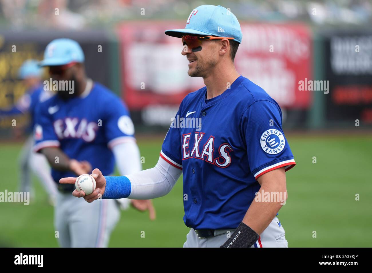 Texas Rangers' Nick Ahmed warms up prior to a spring training baseball ...