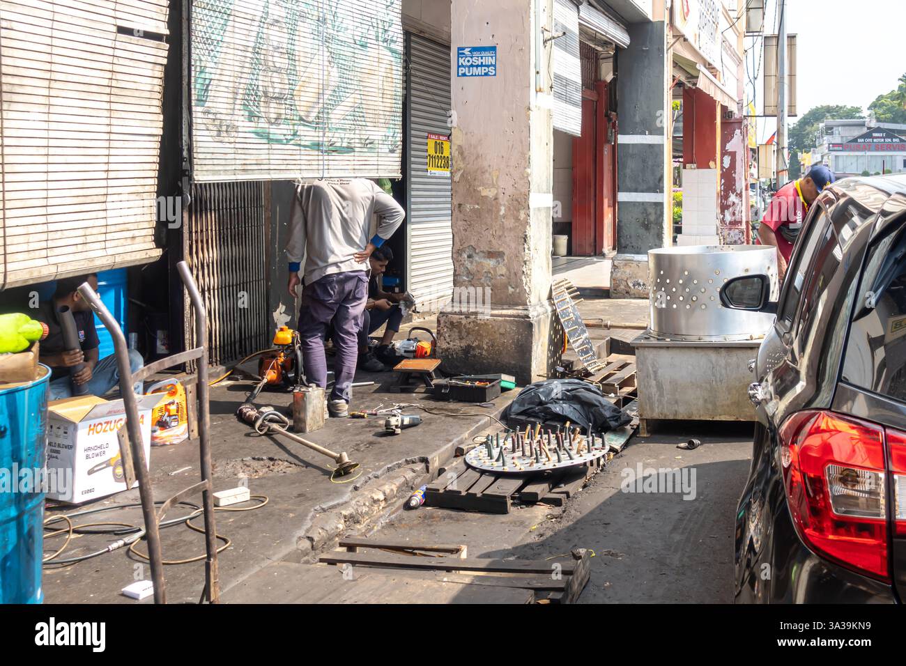 Tools scattered on a road, repair shop, cars, working tools, workers ...