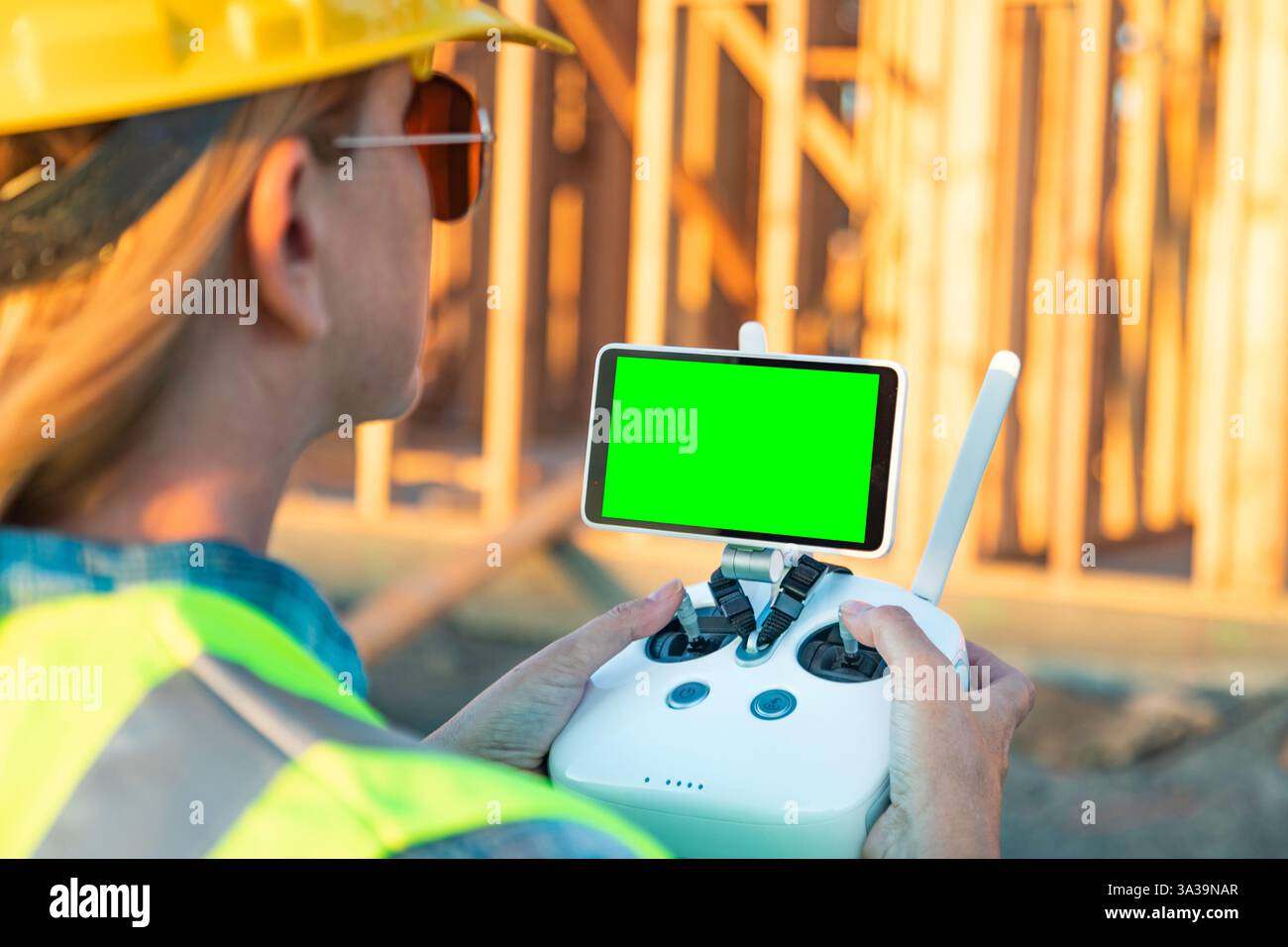 Female UAV Drone Pilot Wearing Personal Protection Equipment Holding ...