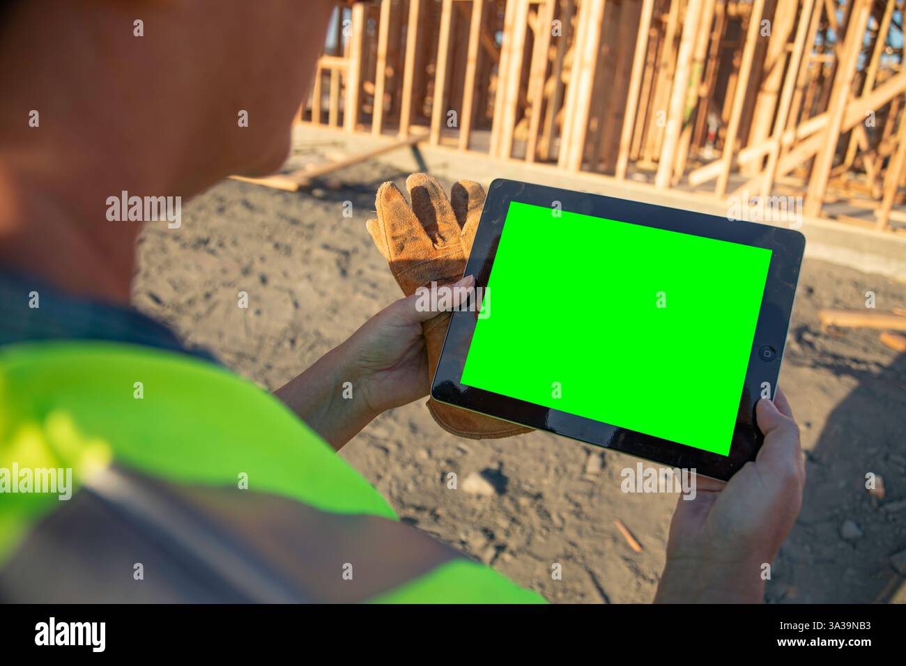 Female Construction Worker At Construction Site Holding Computer Tablet ...