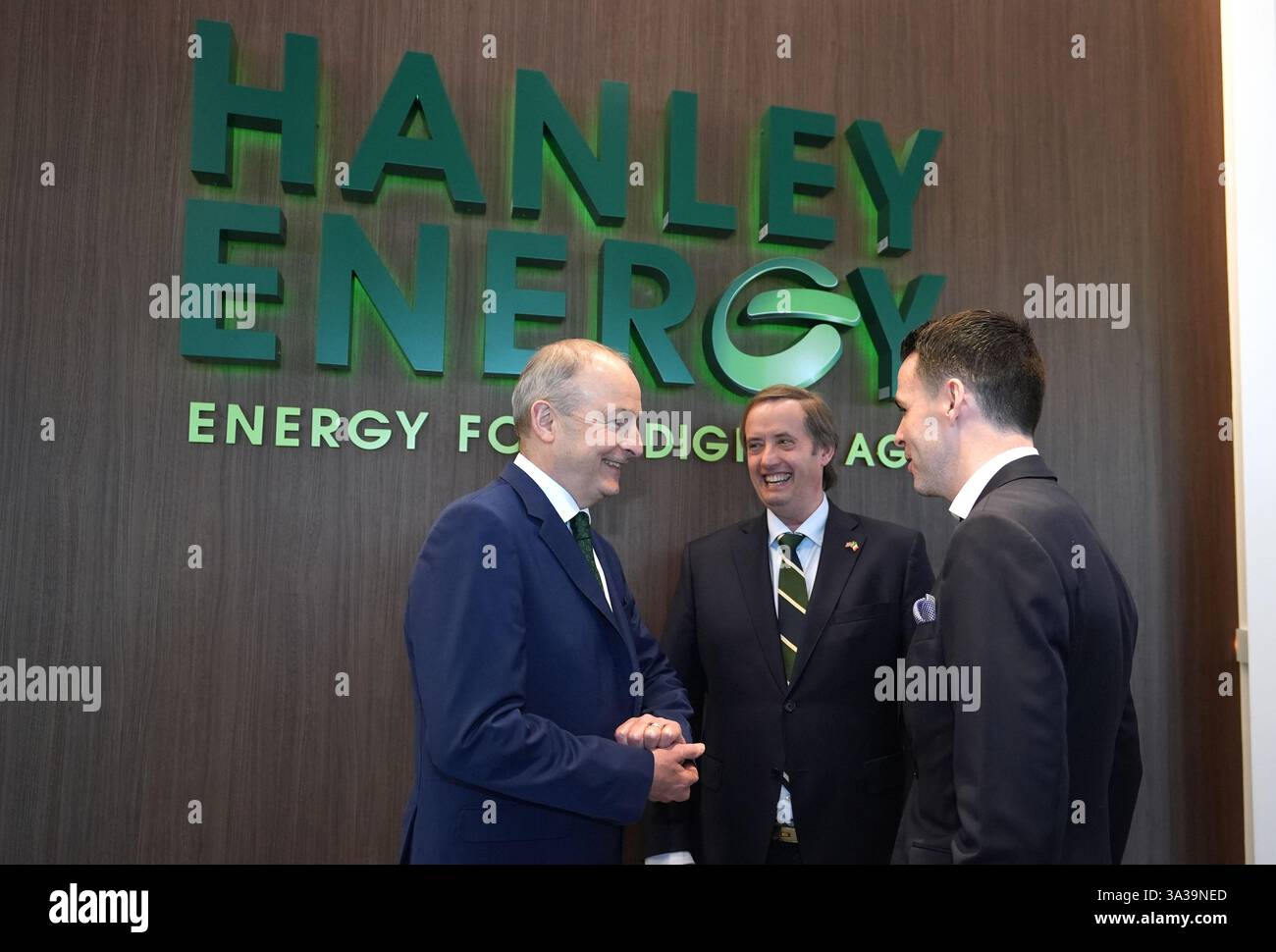 Taoiseach Micheal Martin speaks with Clive Gilmore (centre) and Niall ...