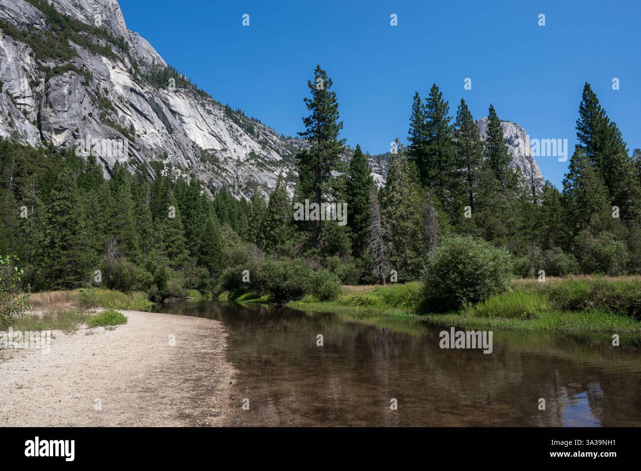 The Merced river, flowing through Yosemite National Park, on a still ...