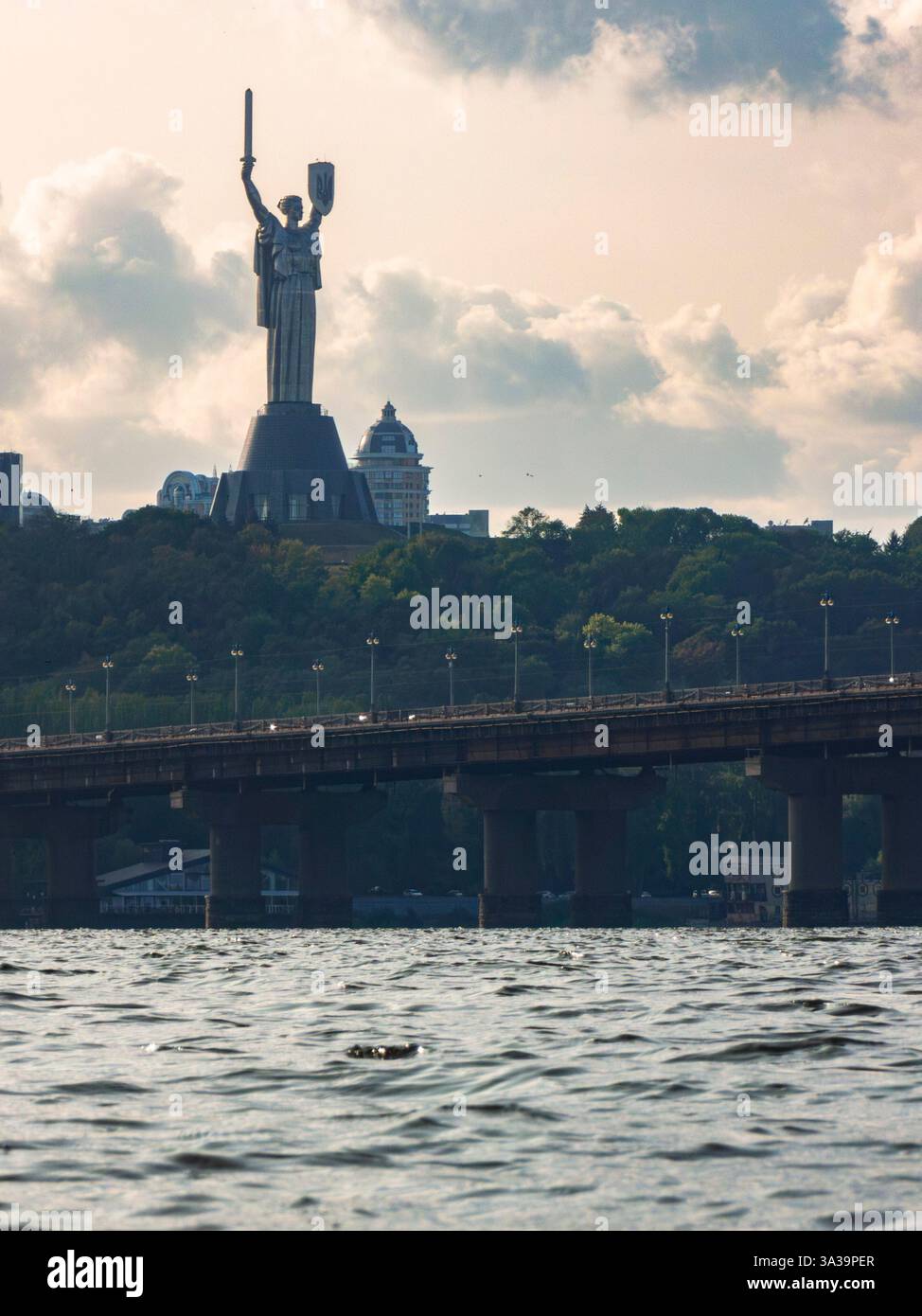 Mother Ukraine Monument stands tall against a soft sky, reflecting the ...
