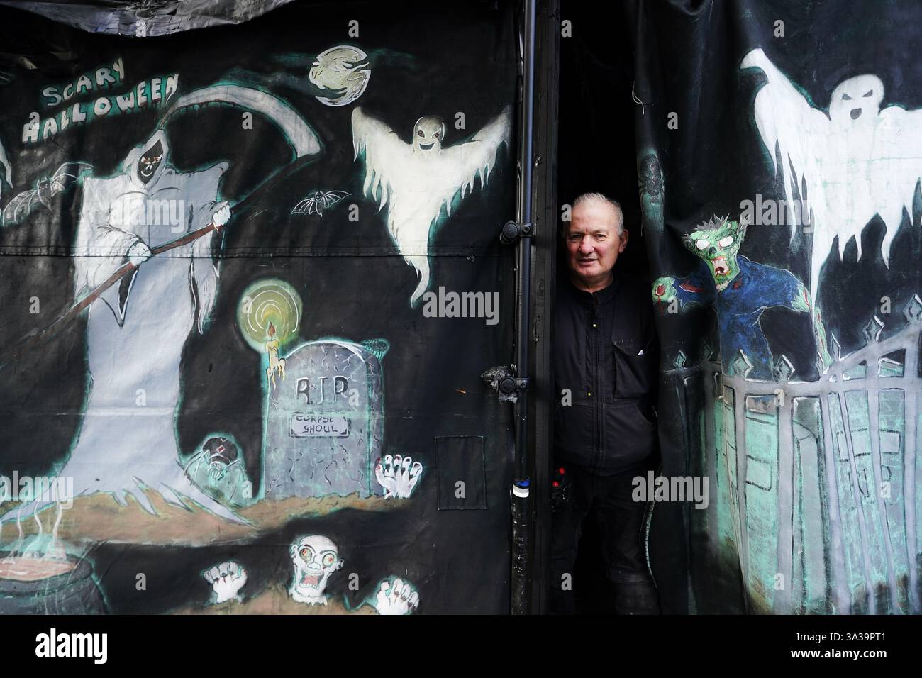 Electrician Ken Carraher continues preparations on his Halloween House ...