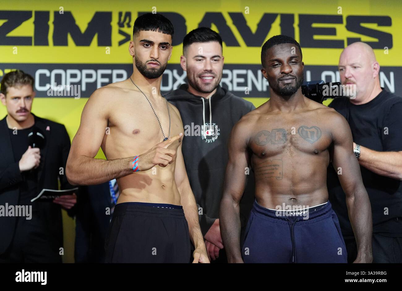 Adam Azim (left) and Ohara Davies (right) during a weigh in at the ...