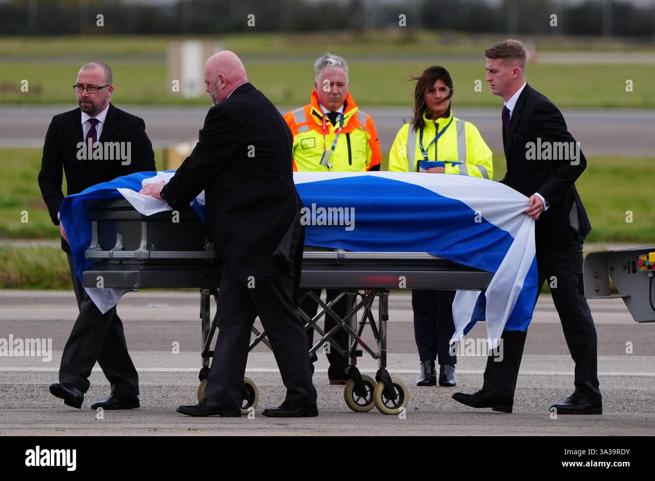 The coffin of former first minister of Scotland Alex Salmond, draped in ...