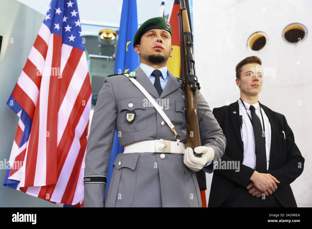 An honour guard and a German federal police (BKA) officer await the ...