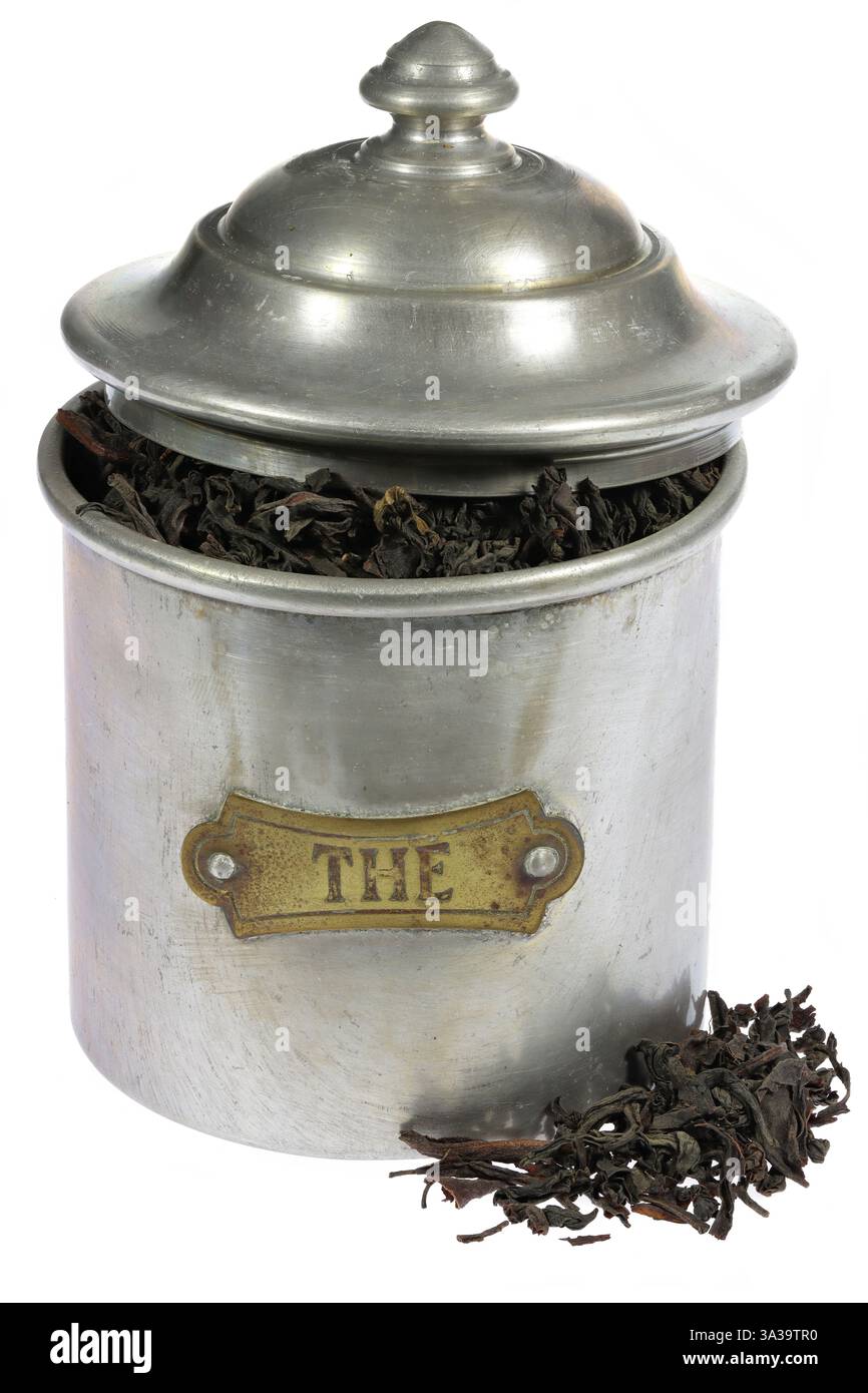 Ceylon Black Tea in a vintage French aluminum lidded tin isolated on ...