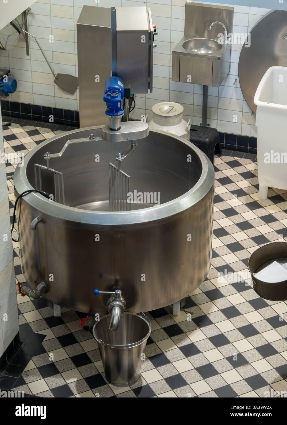 Cow's milk cheese production process at cheese factory in North Holland ...