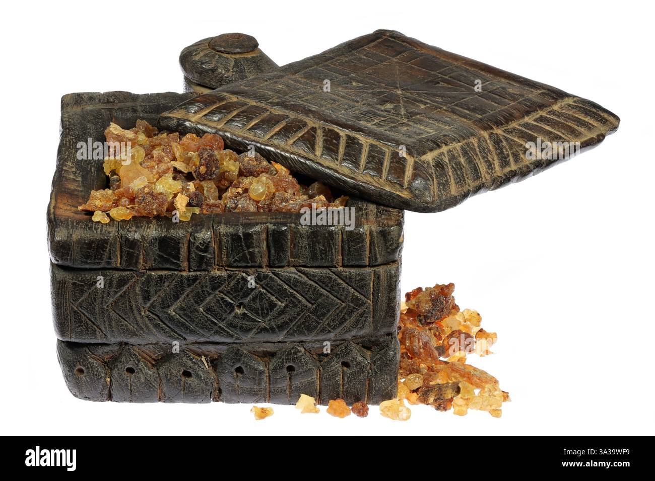 myrrh resin from Oman in a wooden box isolated on white background ...