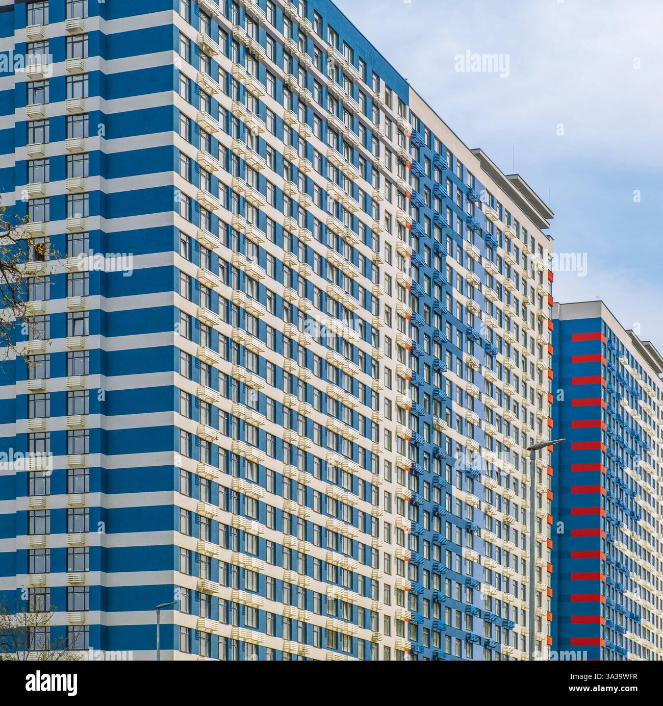Tall buildings adorned with bold stripes create a striking visual ...