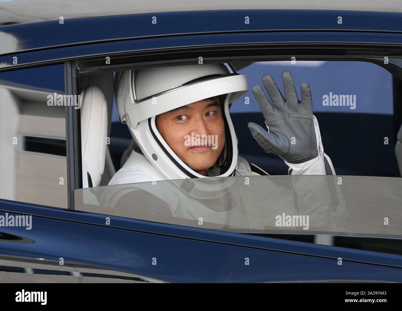 SpaceX NASA Crew-10 mission JAXA Astronaut Takuya Onishi waves as he ...