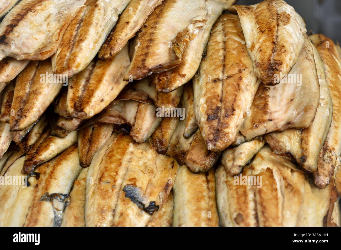Grilled fish roast. Fast food, street food fried fish Stock Photo - Alamy