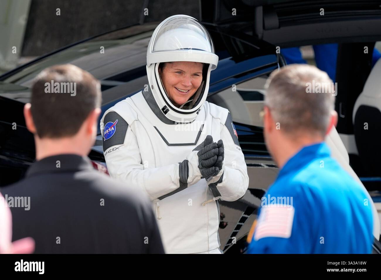Astronaut Anne McClain greets friends and family as she leaves the ...