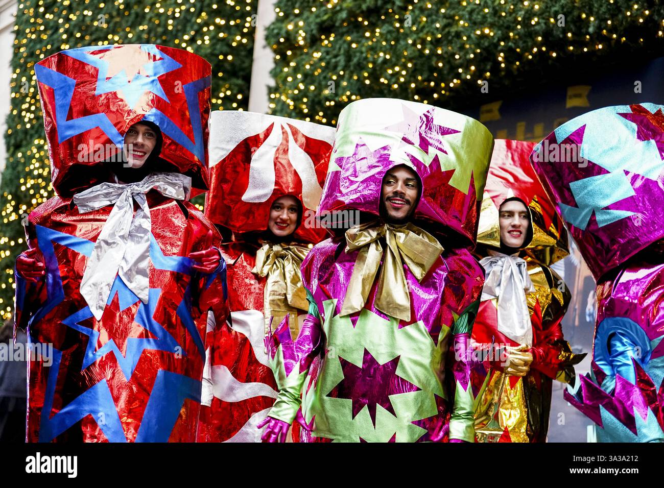 People dressed as Christmas Crackers pose for photographs during the ...