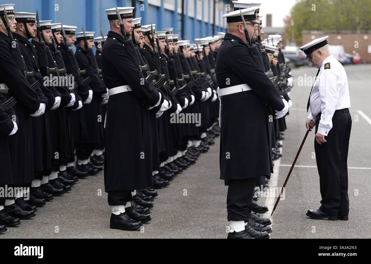 A Royal Navy State Ceremonial Instructor measures the distance between ...