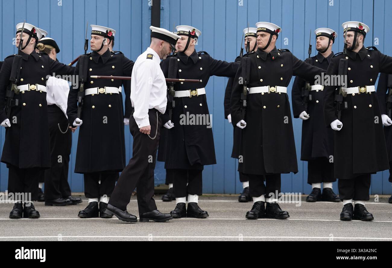 A Royal Navy State Ceremonial Instructor checks the distance between ...