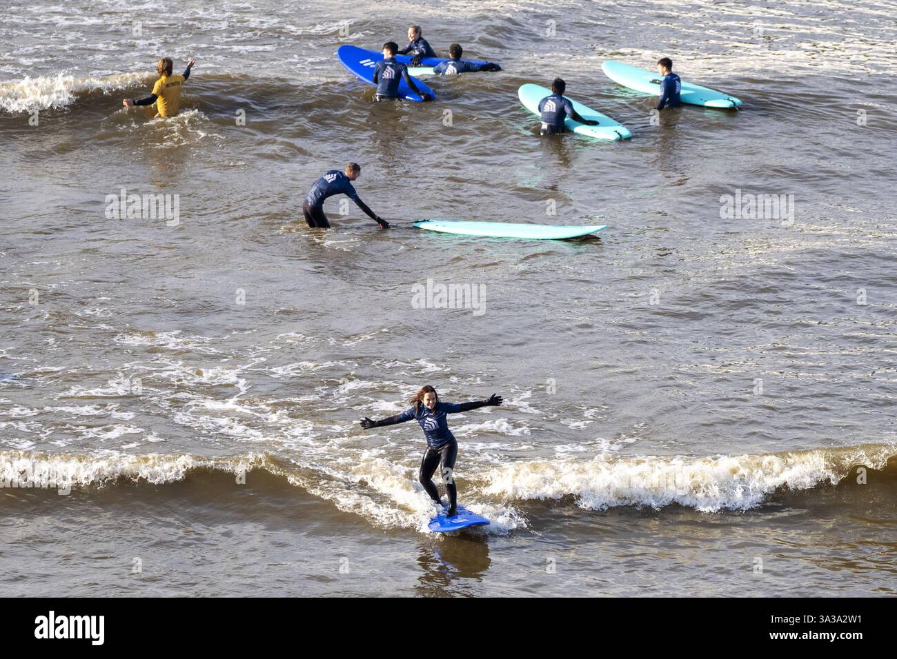 EMBARGOED TO 1400 GMT TUESDAY NOVEMBER 5 Surfers try out the new wave ...