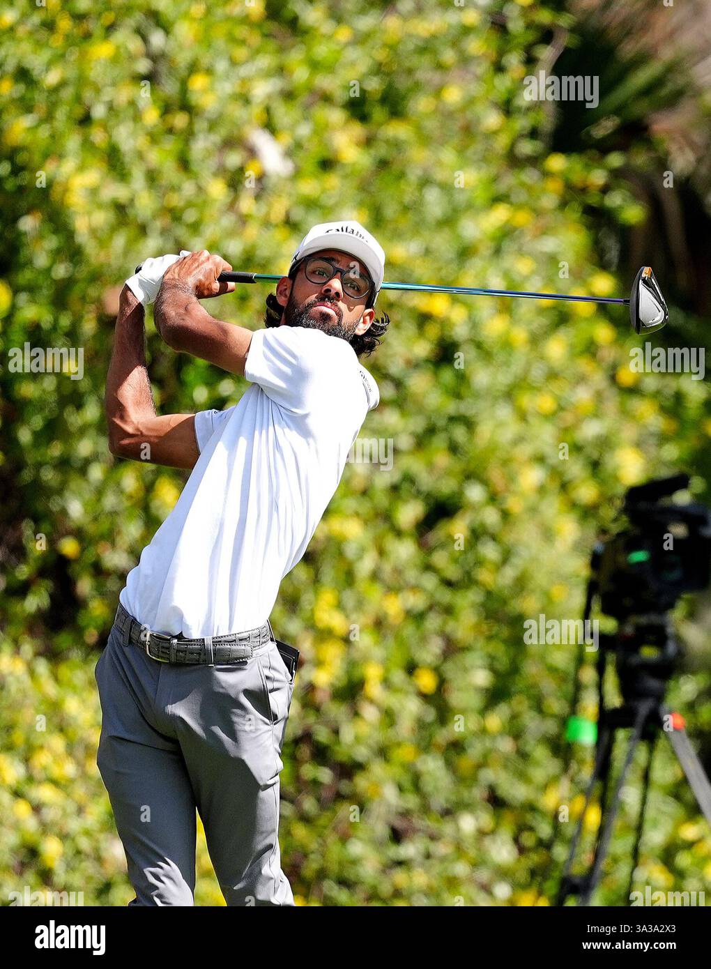 PONTE VEDRA BEACH, FL - MARCH 14: PGA golfer Akshay Bhatia plays his tee shot on the 2nd hole ...