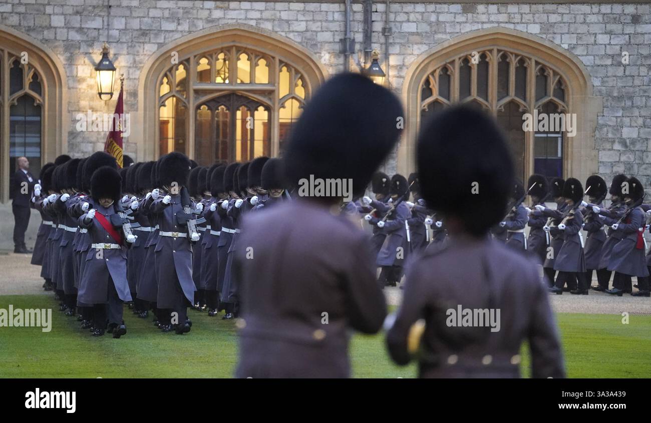Members of the 1st Battalion Welsh Guards, march into the quadrangle ...