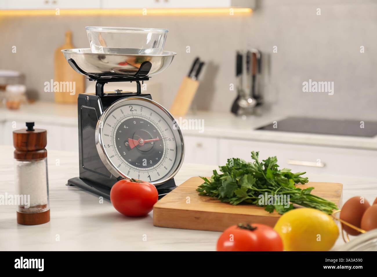Retro mechanical kitchen scale and different food products on white ...