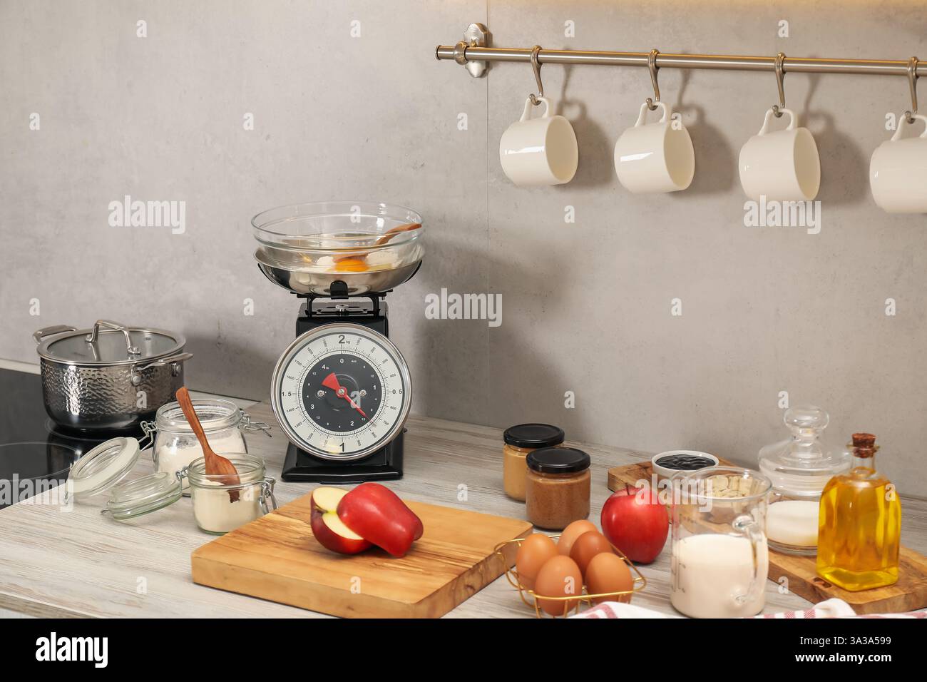 Retro mechanical kitchen scale and different food products on wooden ...